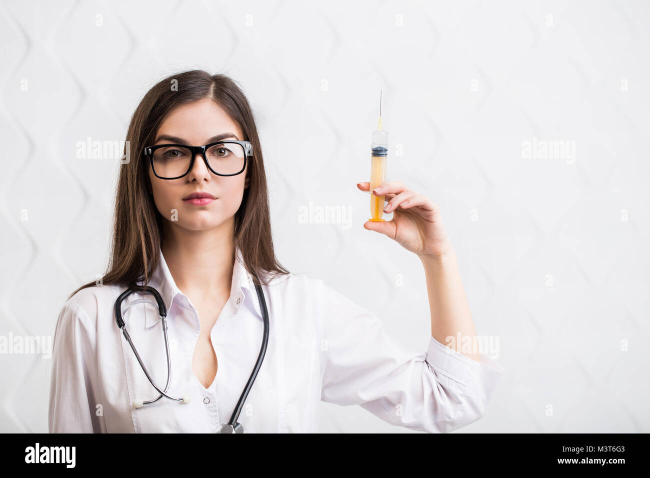 Doctor Gets Ready for Injection Stock Photo - Alamy