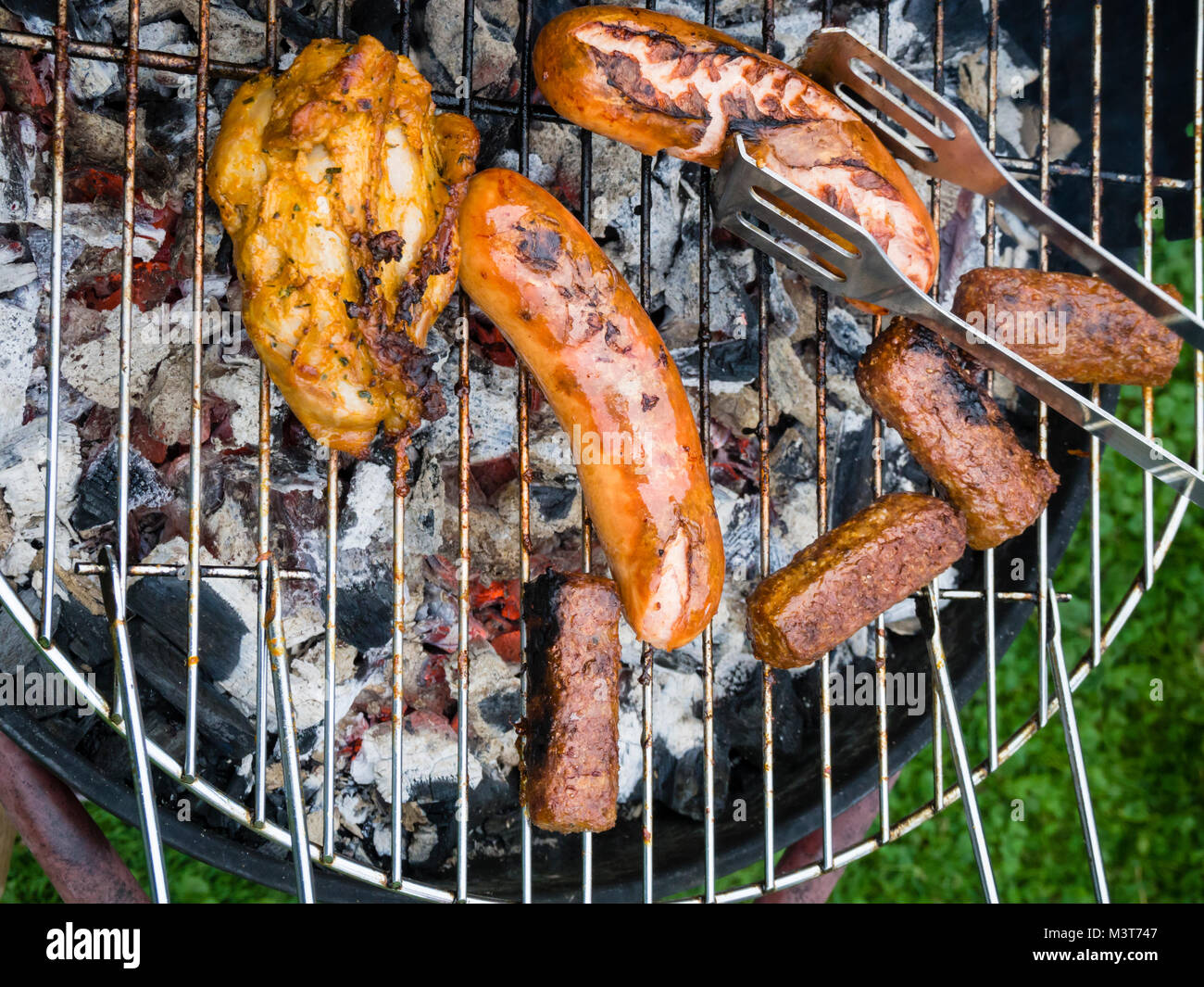 Cooking the meat on the barbecue hi-res stock photography and images ...