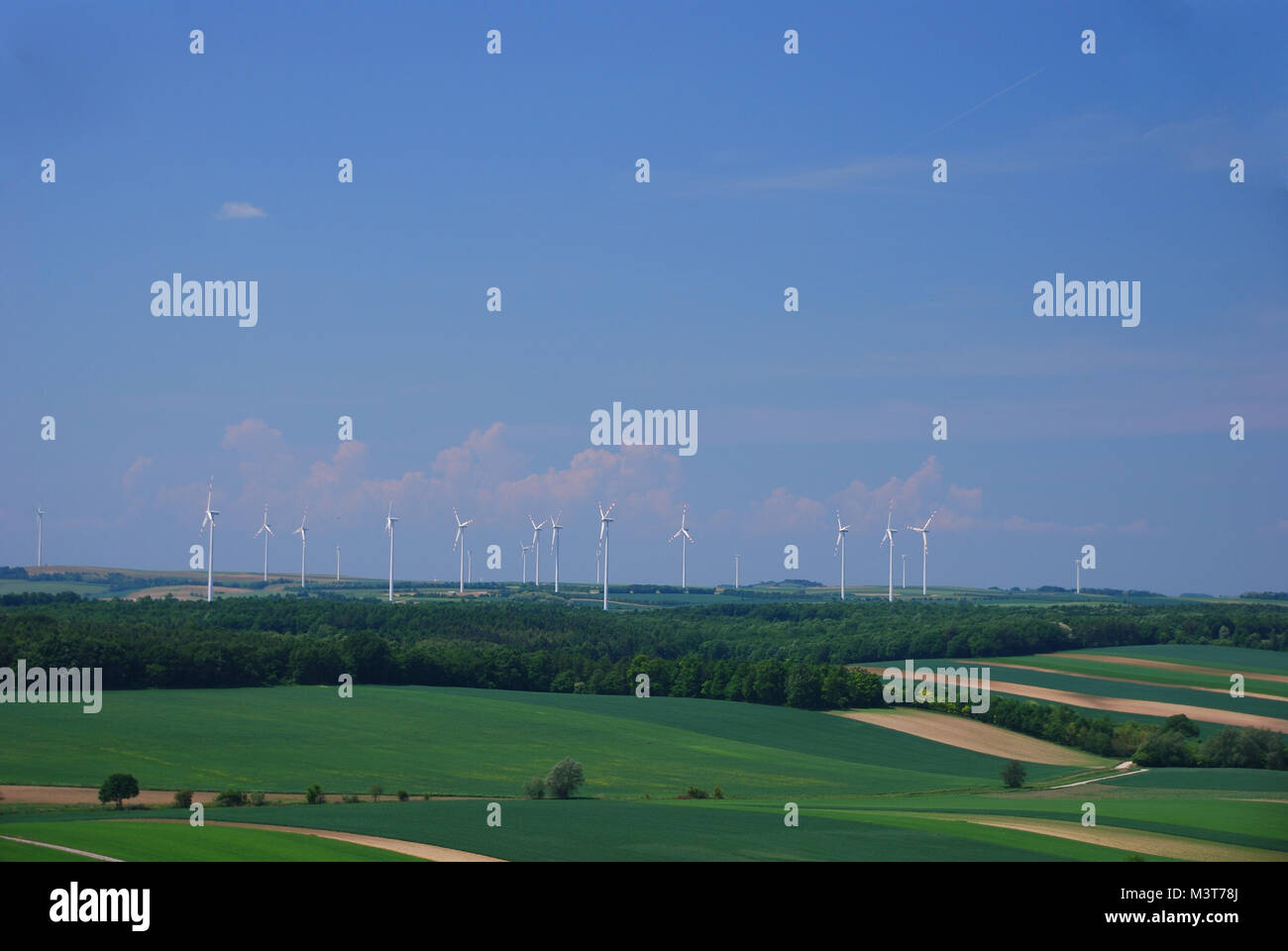 many wind turbines are in an area with fields Stock Photo - Alamy