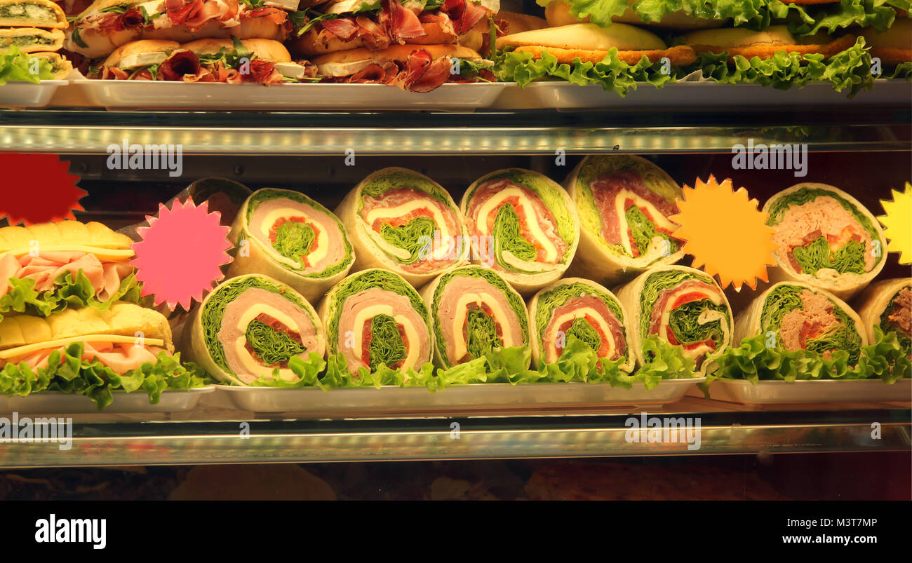 great and inviting window full of sandwiches and snacks in the well ...