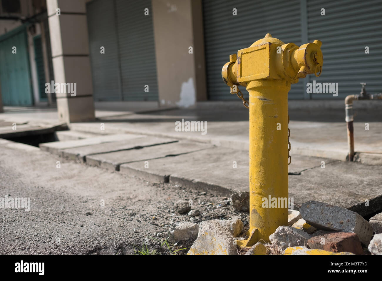Yellow fire hydrant outdoor Stock Photo - Alamy