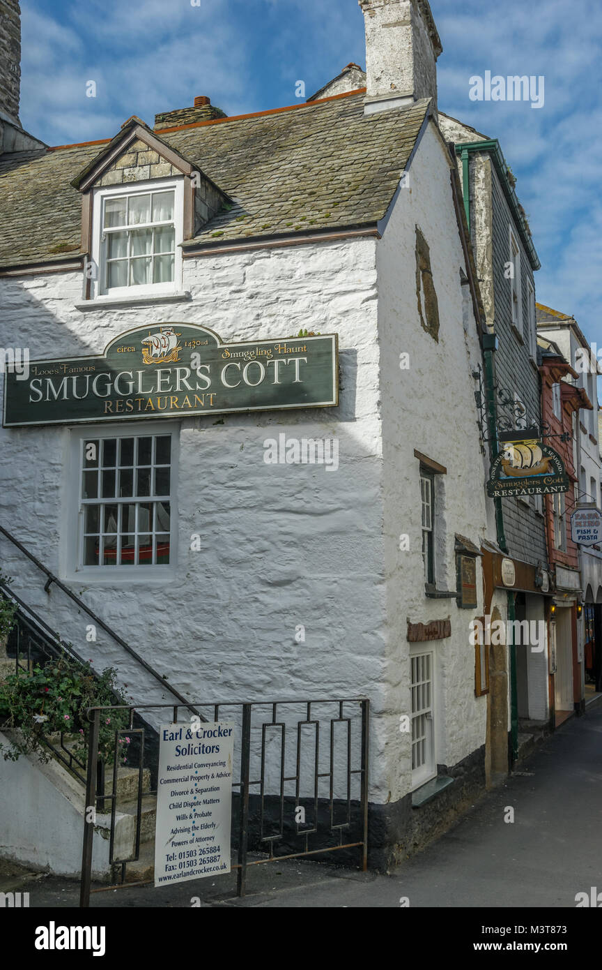 Very old smugglers cottage now a restaurant Stock Photo - Alamy