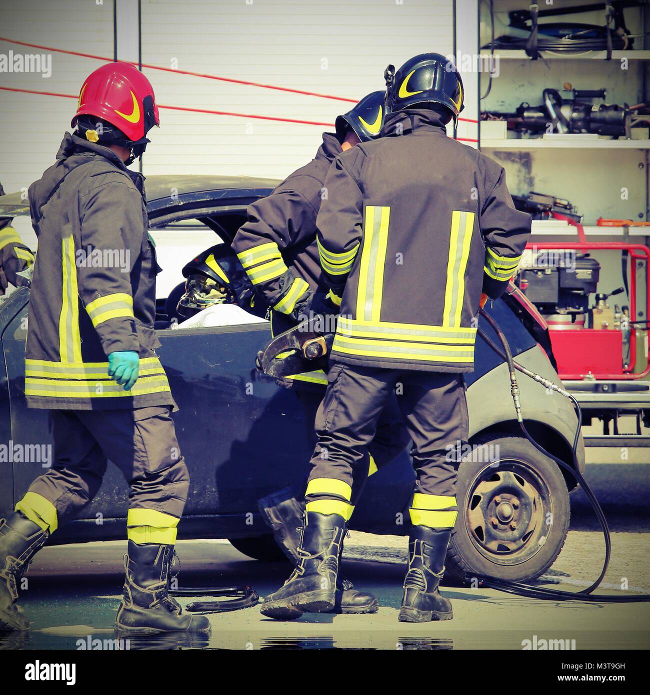 firemen in action during the accident Stock Photo - Alamy