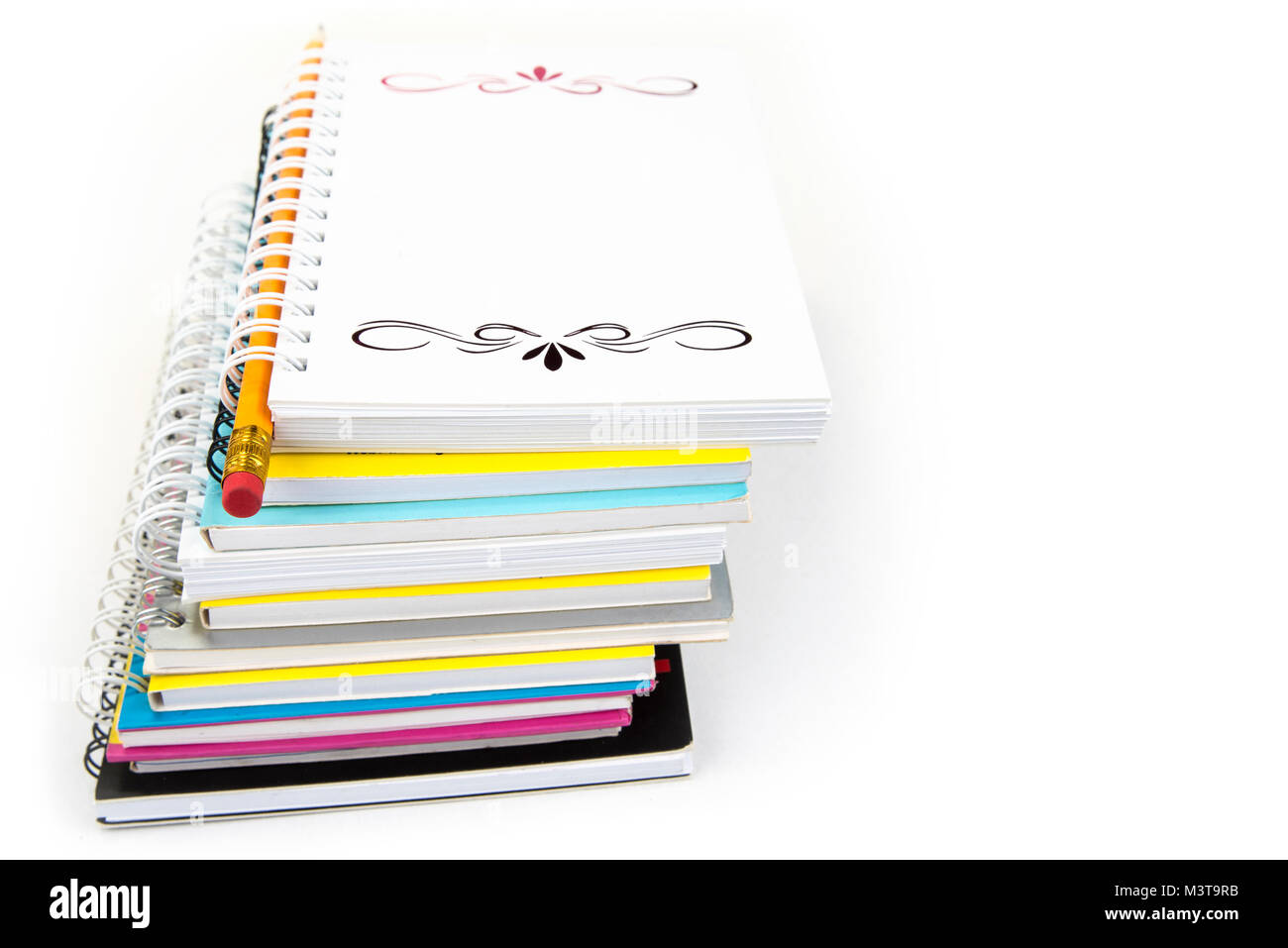 Stack of colorful notebooks with pencils isolated on white Stock Photo ...