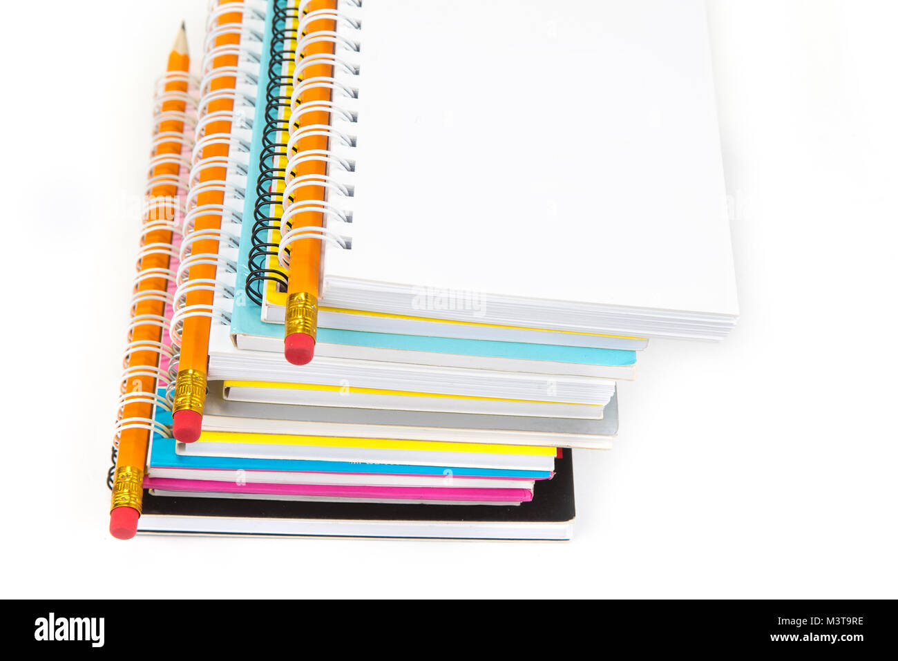 Stack of colorful notebooks with pencils isolated on white Stock Photo ...