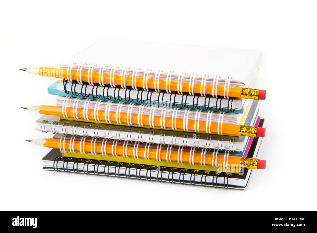 Stack of colorful notebooks with pencils isolated on white Stock Photo ...