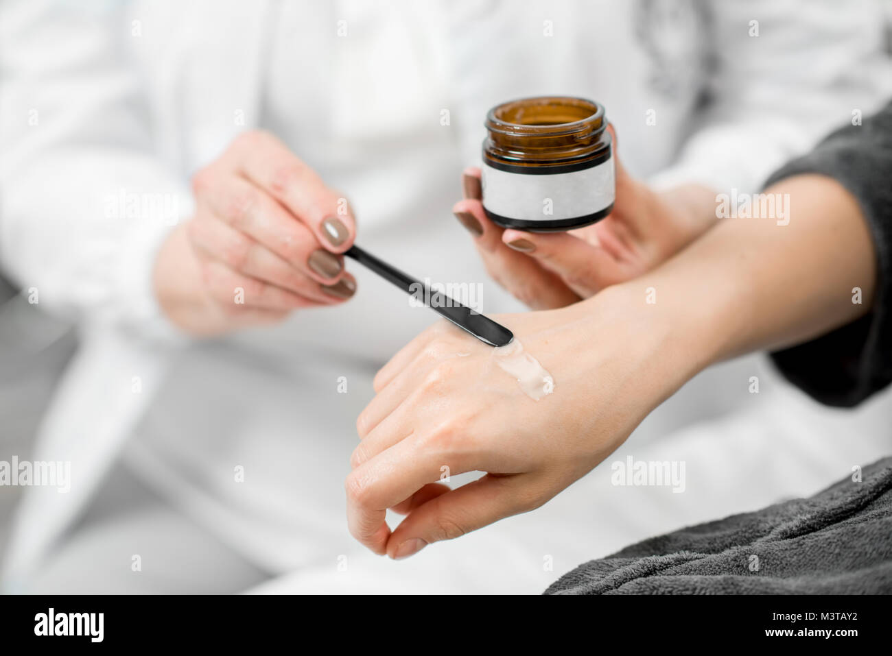 Woman applying cream arm close up hi-res stock photography and images ...