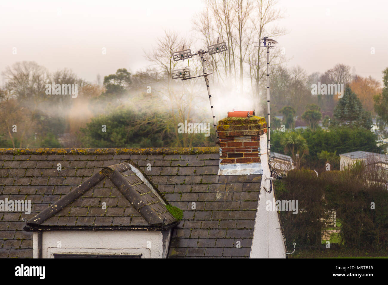 Chimney smoke cottage hi-res stock photography and images - Alamy
