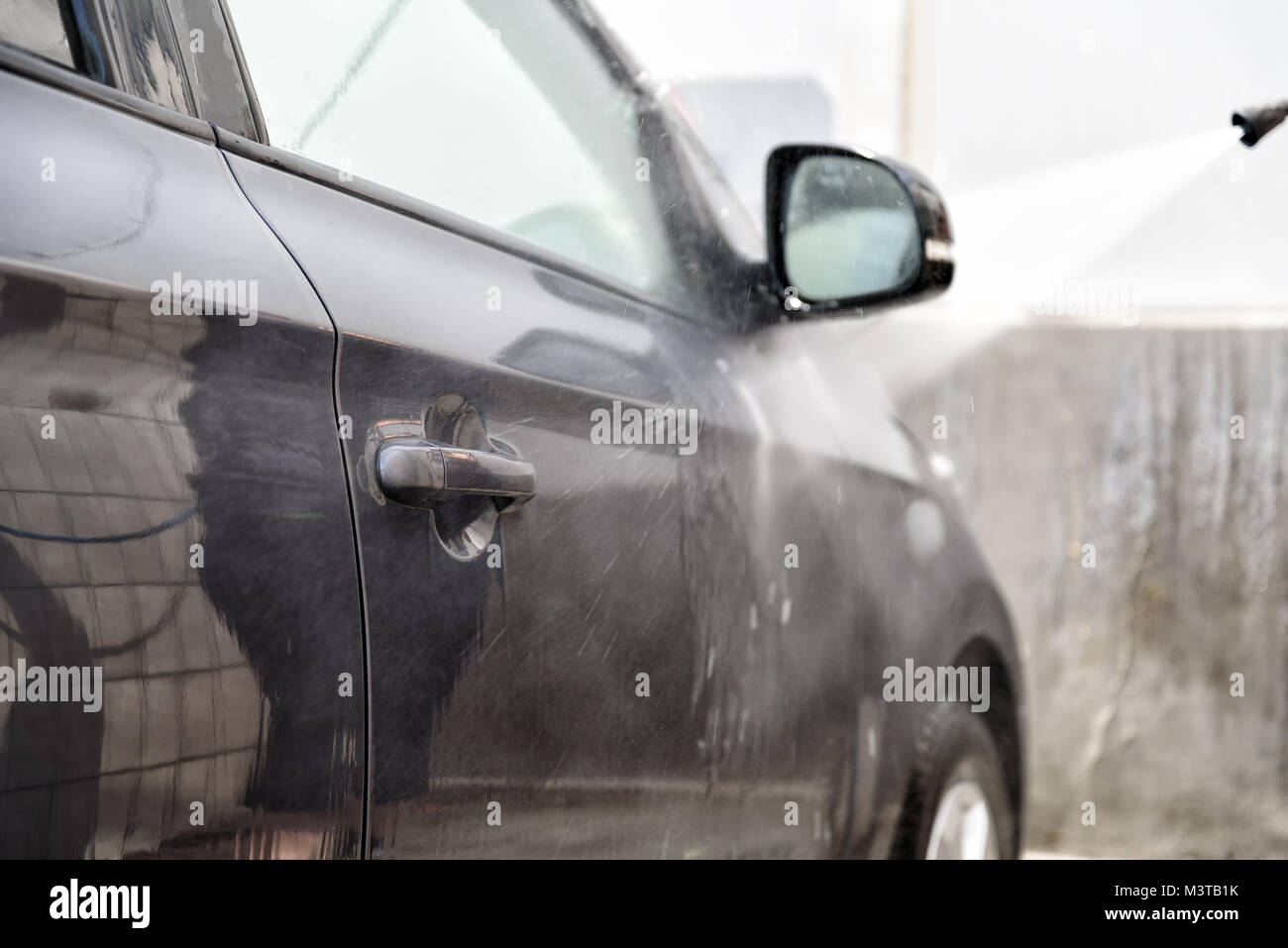 car is washed at the car wash Stock Photo - Alamy