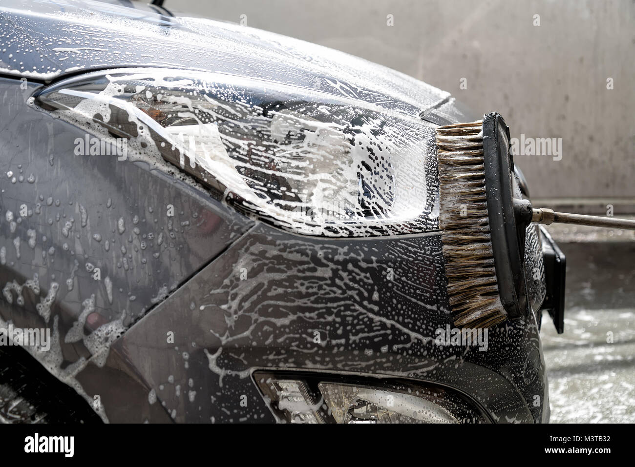 car is washed at the car wash Stock Photo - Alamy