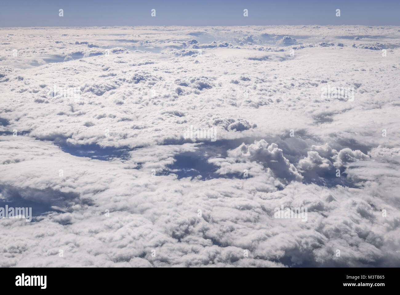 Clouds seen from plane window hi-res stock photography and images - Alamy