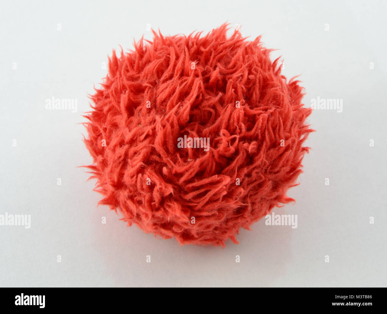 Fluffy Red Ball Stock Photo - Alamy