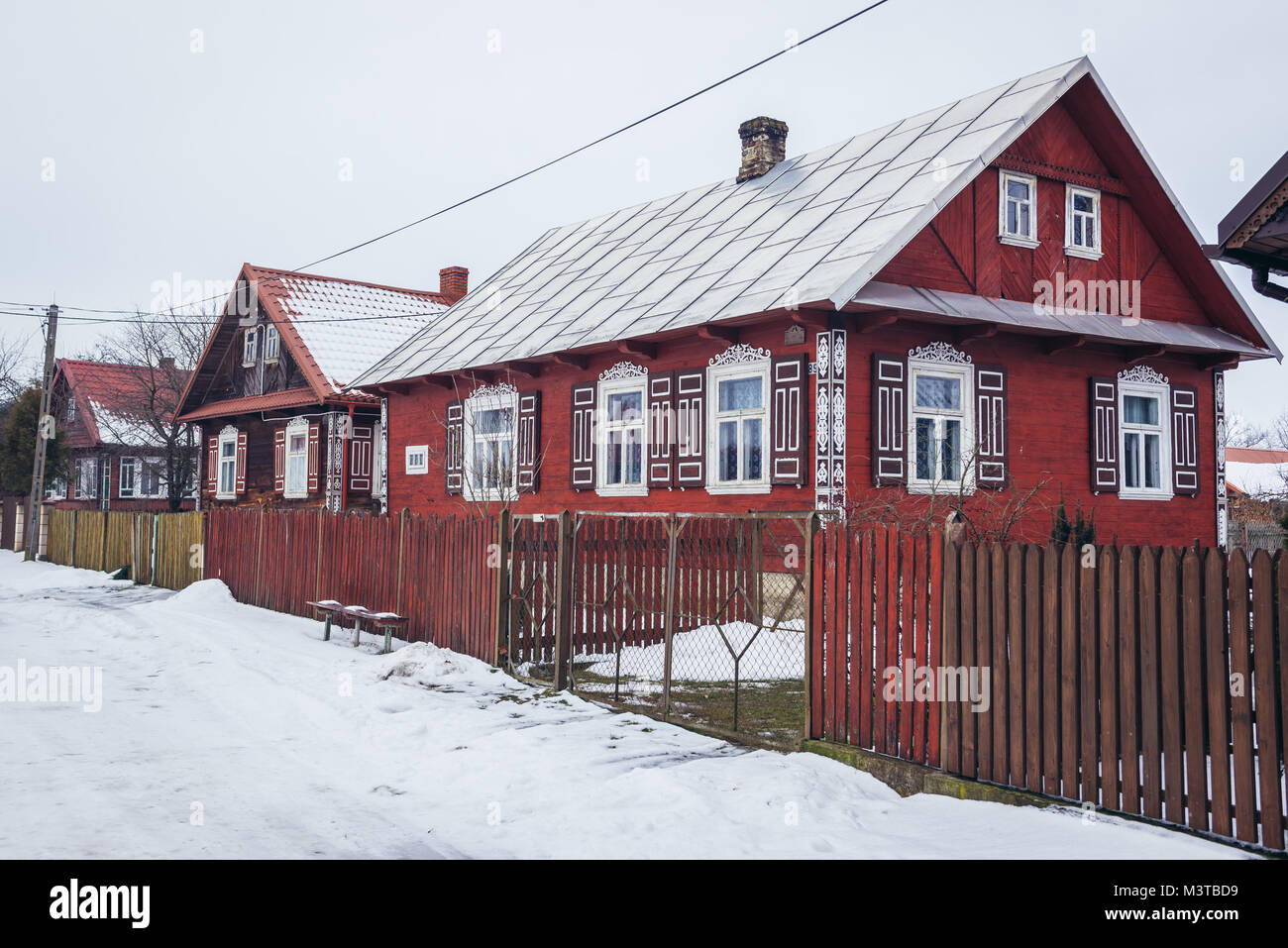 Wooden houses along road in Soce village on so called Land of Open ...