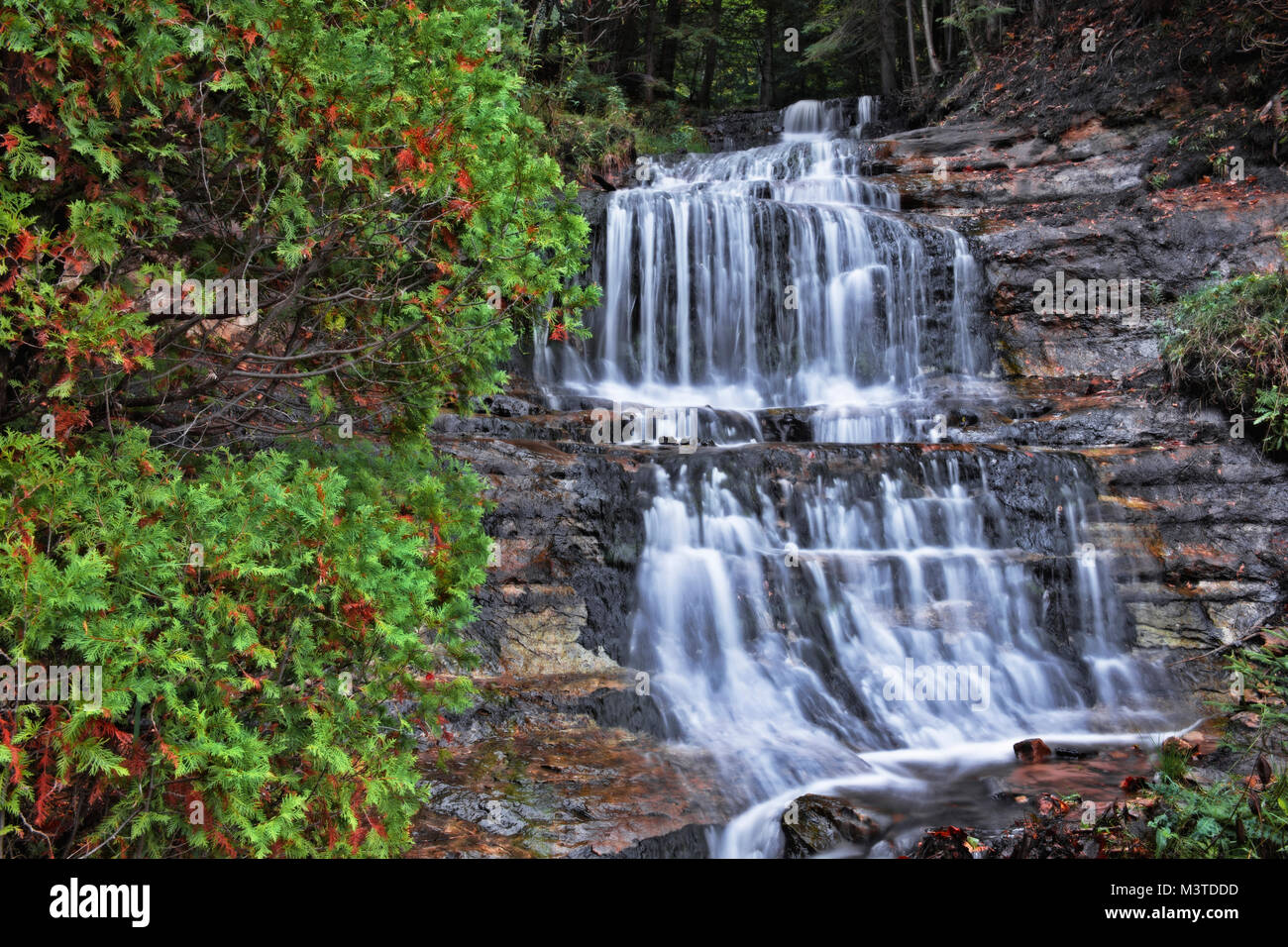 Alger Falls cascades over a series of rocky ledges in the Hiawatha ...