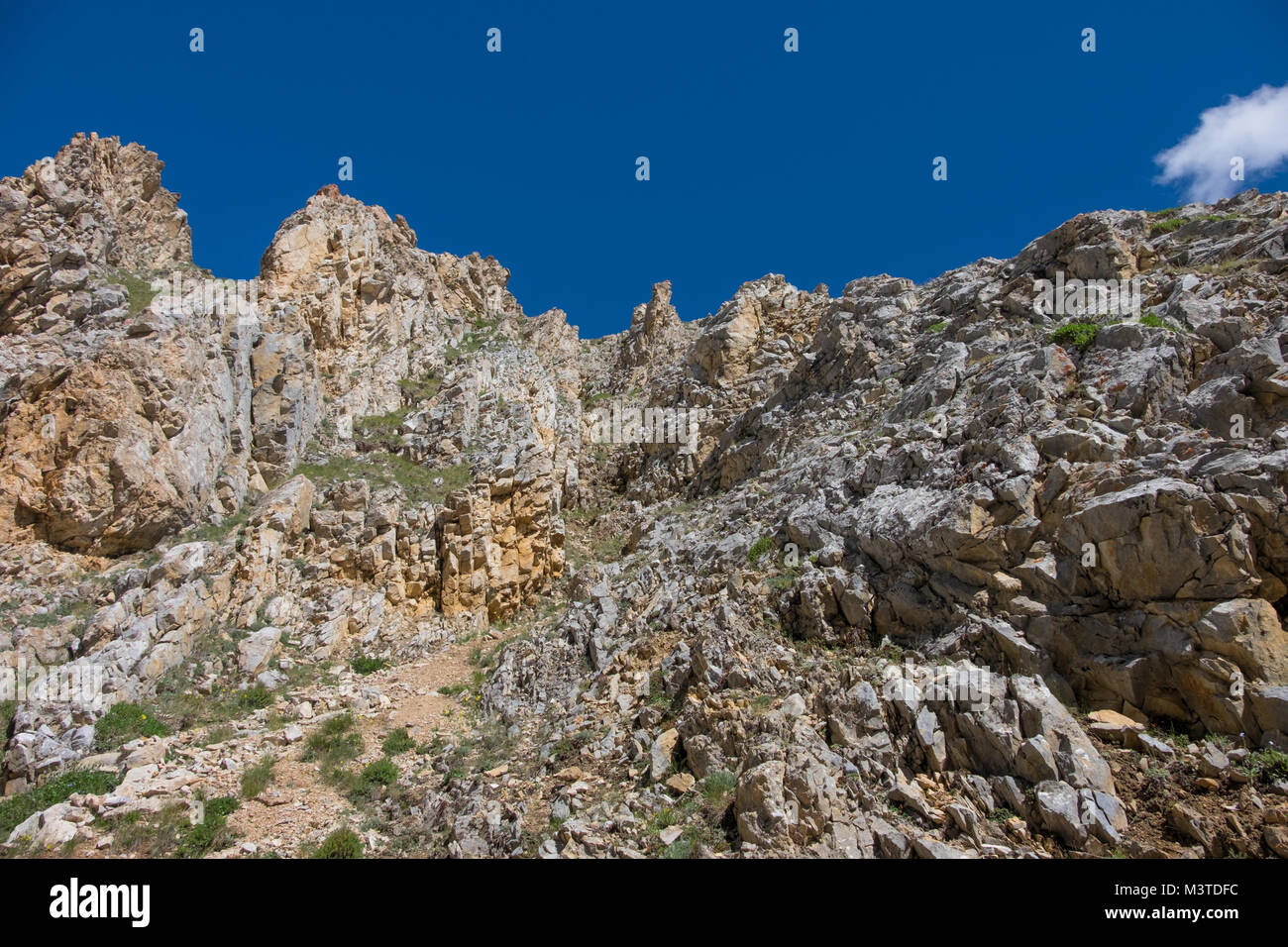 Sharp and dangerous rocks composed of sedimentary rocks Stock Photo - Alamy