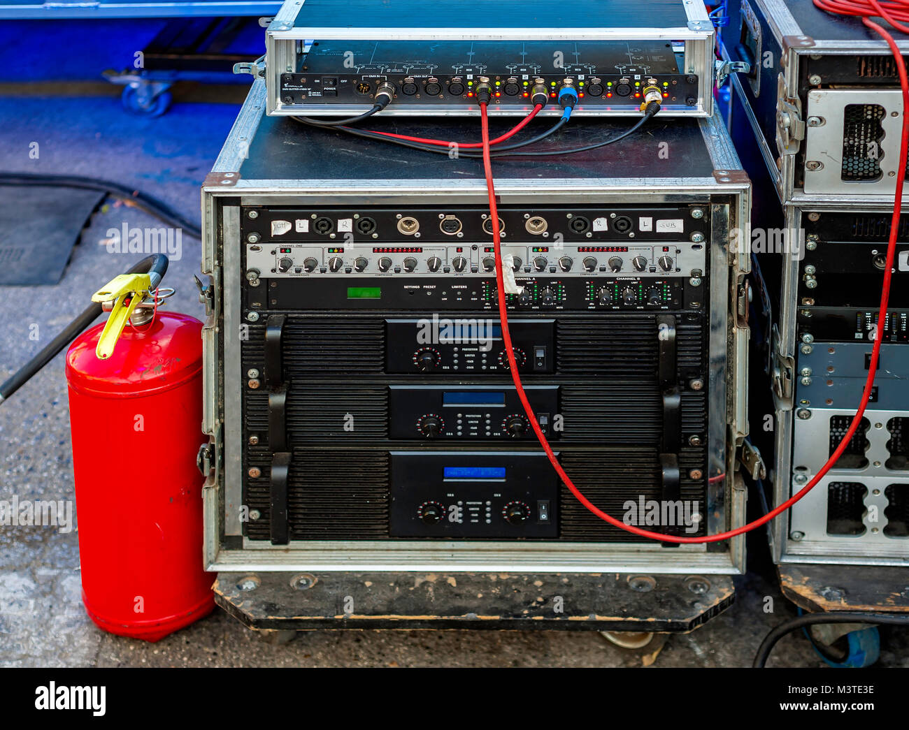 amplifier and fire extinguisher on stage; background of concert Stock ...
