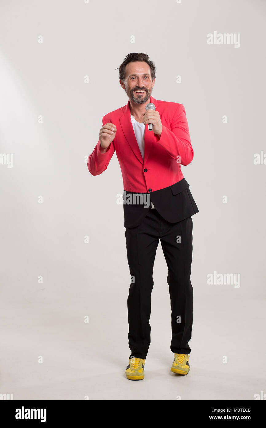 Handsome man in red and black suit Stock Photo - Alamy