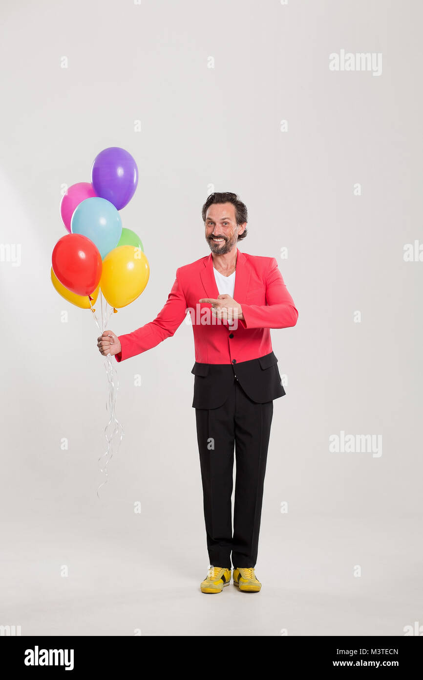 Standing man with balloons hi-res stock photography and images - Alamy