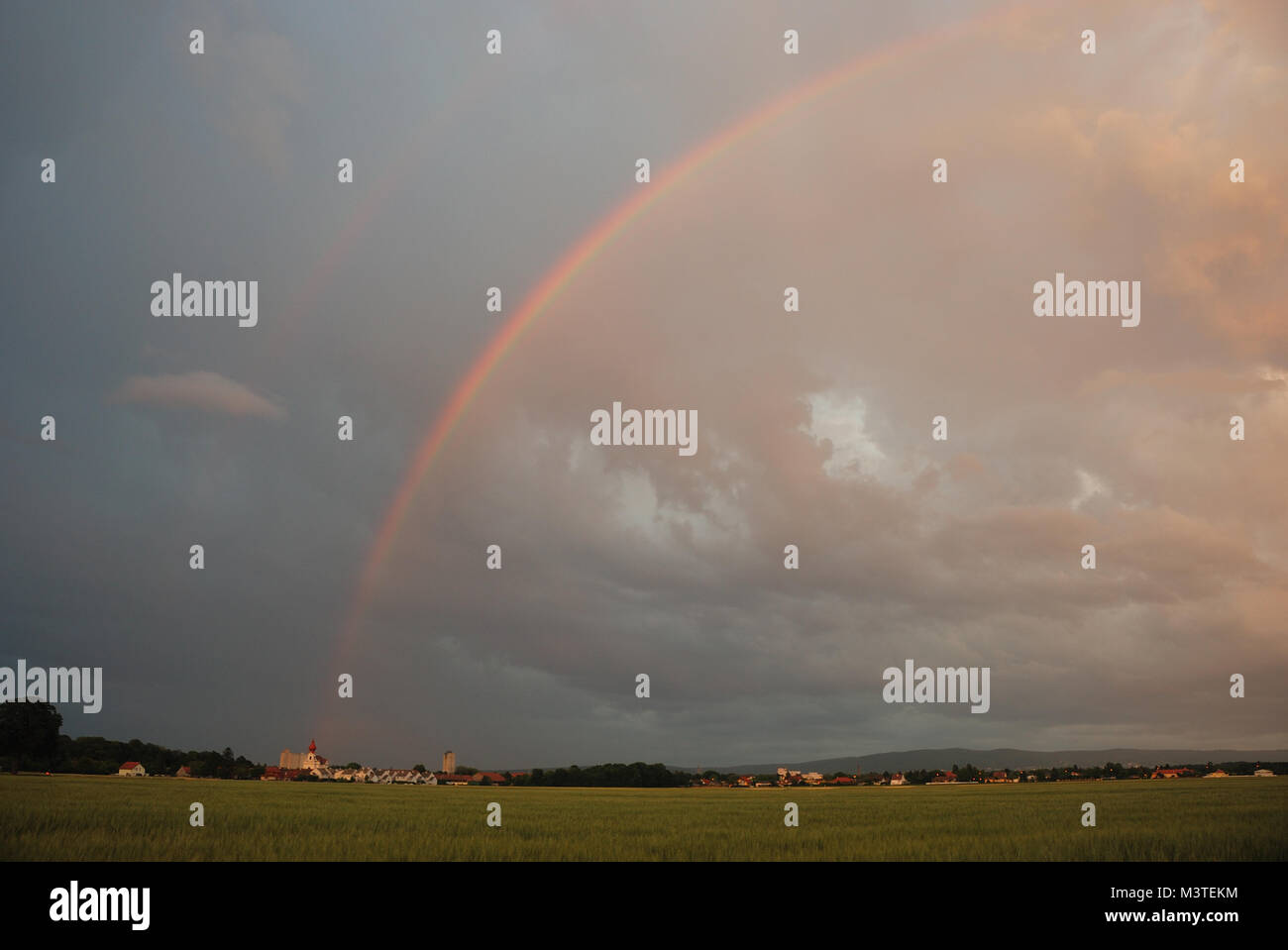 beautiful colorful rainbow after rain in summer Stock Photo - Alamy
