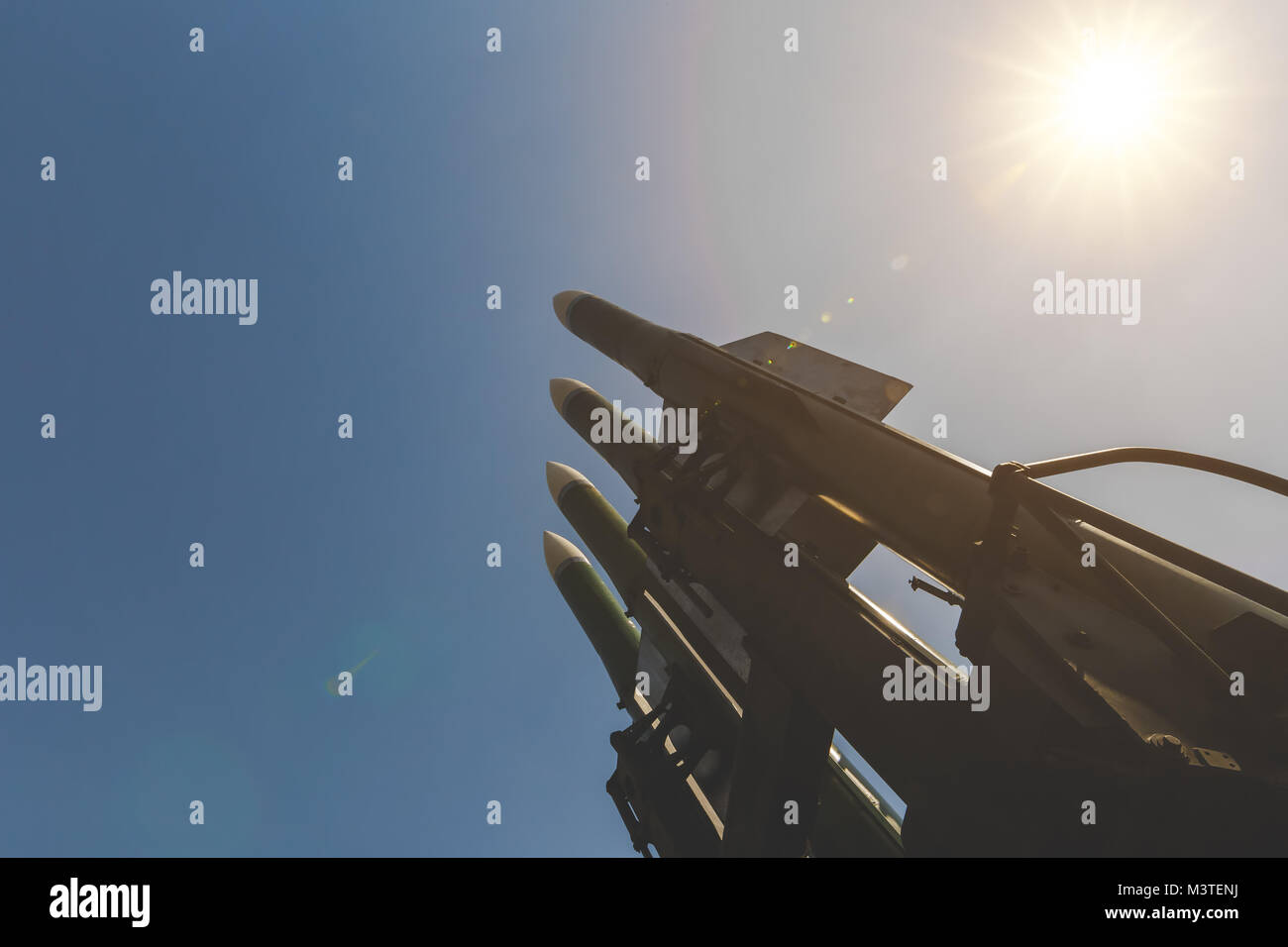 Rockets of an anti-aircraft missile system are directed to the blue sky ...