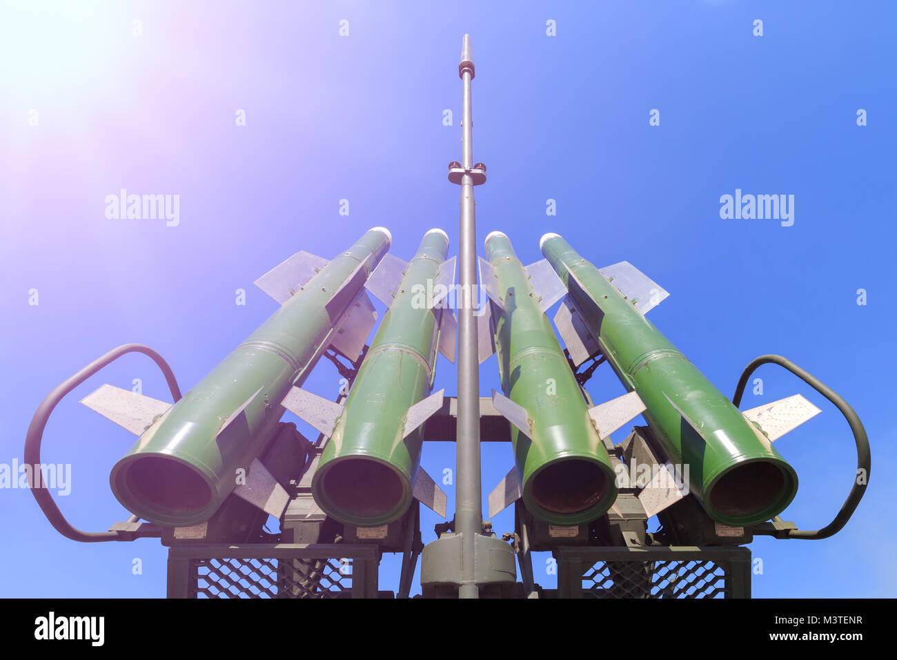 Four missiles of self-propelled system Buk M2 on blue sky background ...