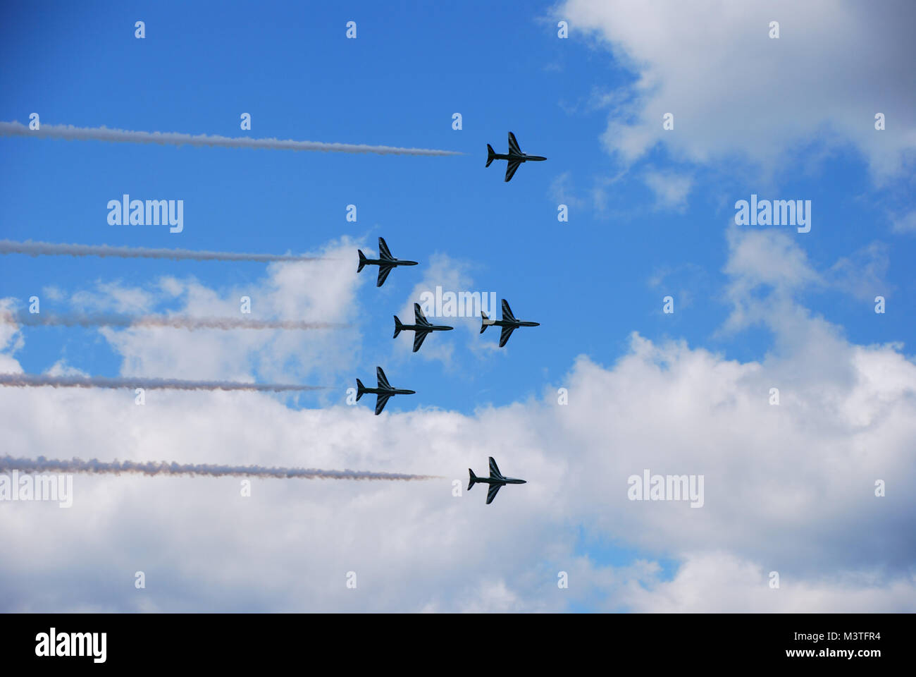 six aircraft fly past very quickly with mist at a flight show Stock ...