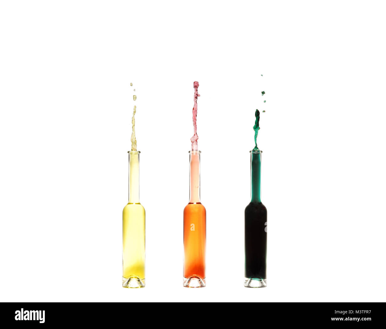 three bottles with colored liquid with bubble on white background ...