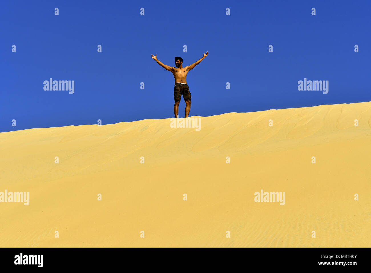 Young man jogging on desert hi-res stock photography and images - Alamy