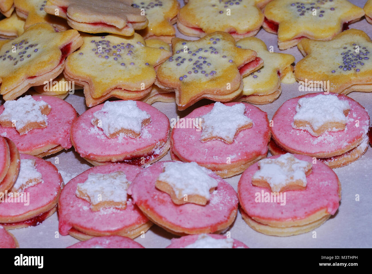 many pink biscuit for christmas star with white sugar Stock Photo - Alamy