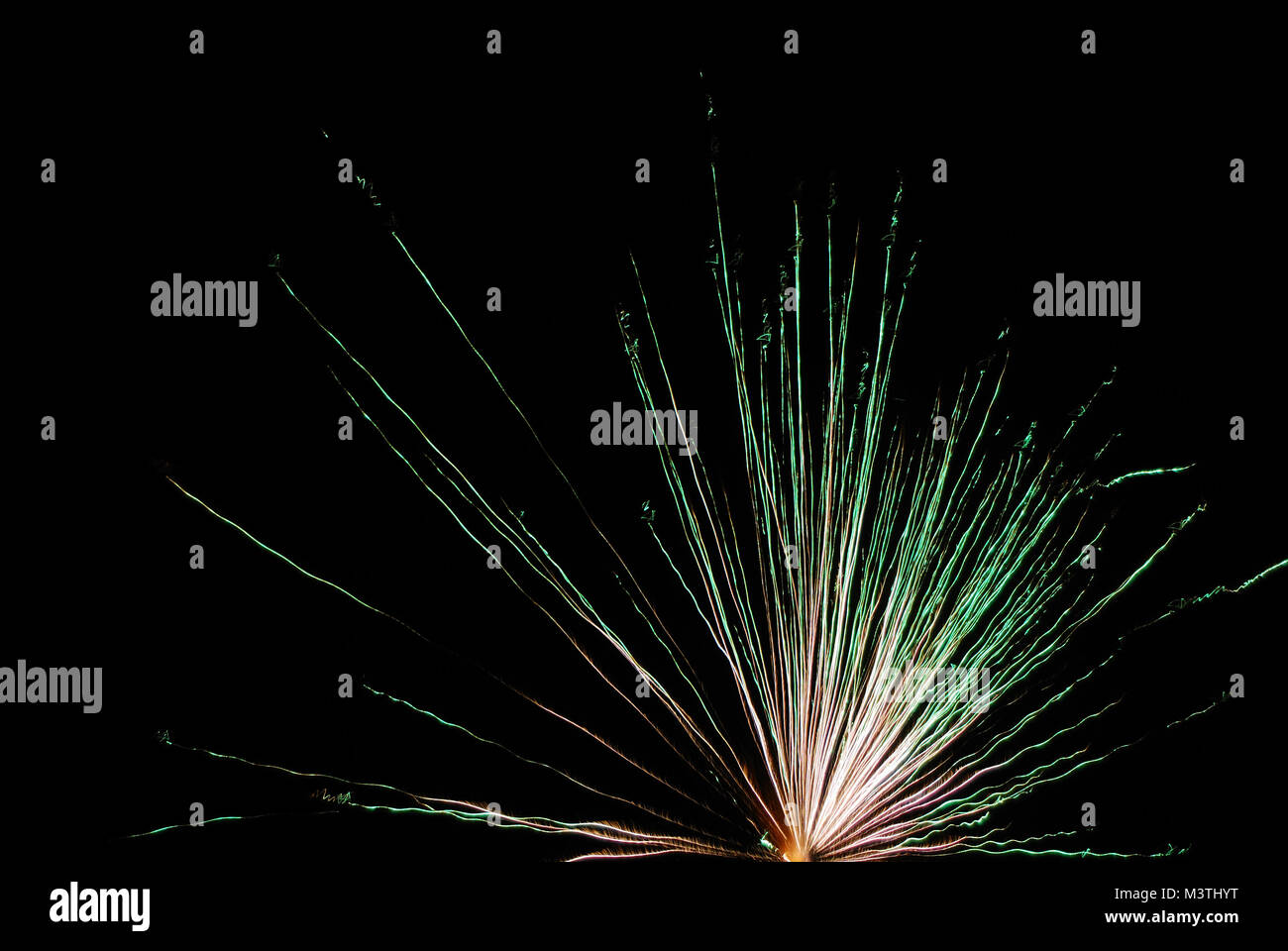 single high explosive in a large green fireworks in the night new year ...