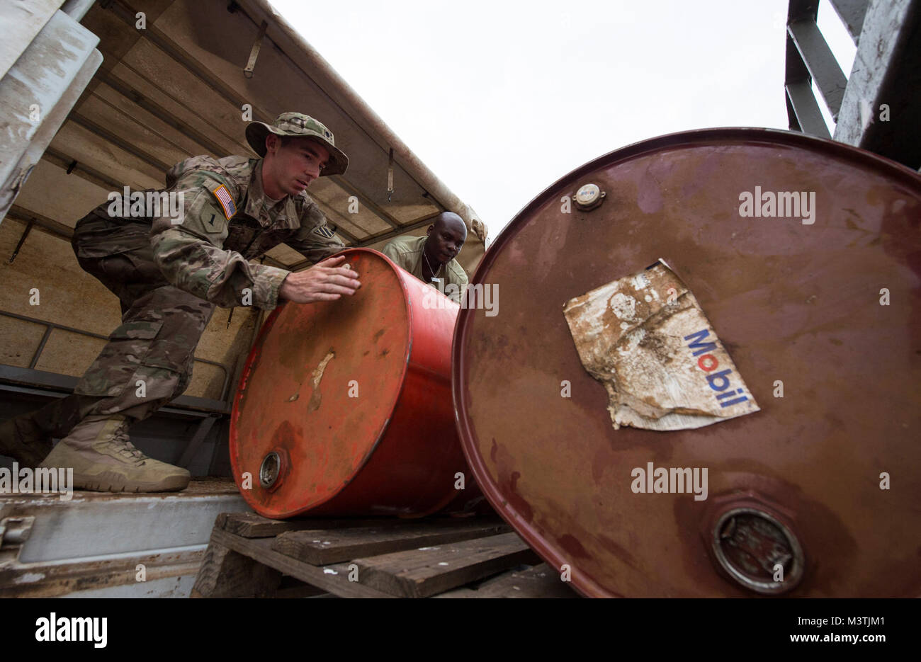 U.S. Army Spc. Benjamin Thompson (left), a Land Combat Electronic ...