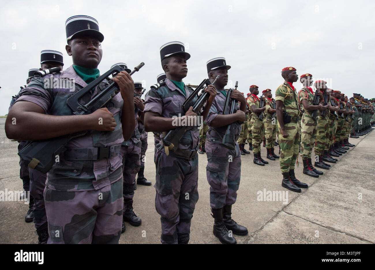 Military members from the Gabonese Armed Forces stand in formation ...