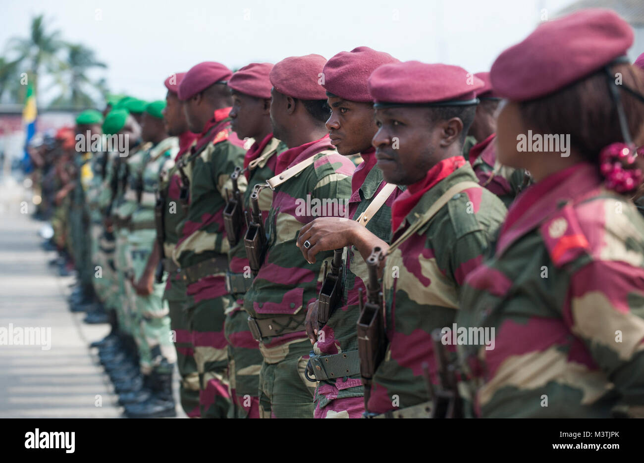 Military members from the Gabonese Armed Forces stand in formation ...