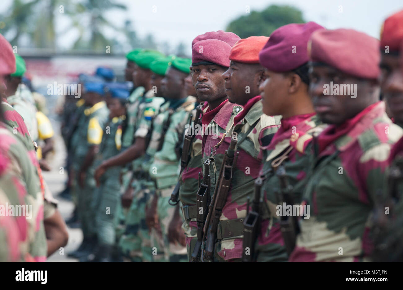 Military members from the Gabonese Armed Forces stand in formation ...