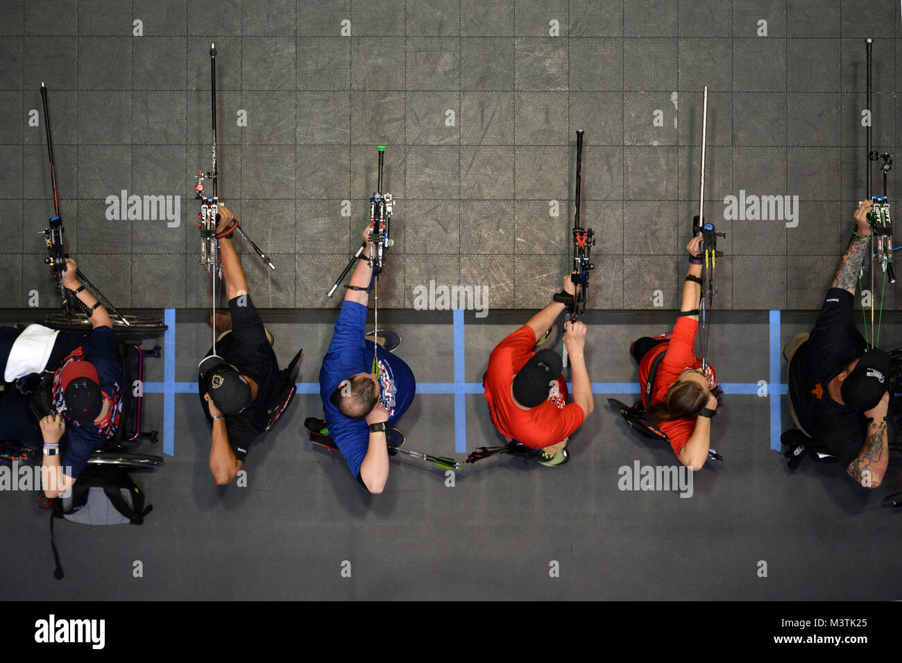 A line of archers compete in the 2016 Department of Defense Warrior ...