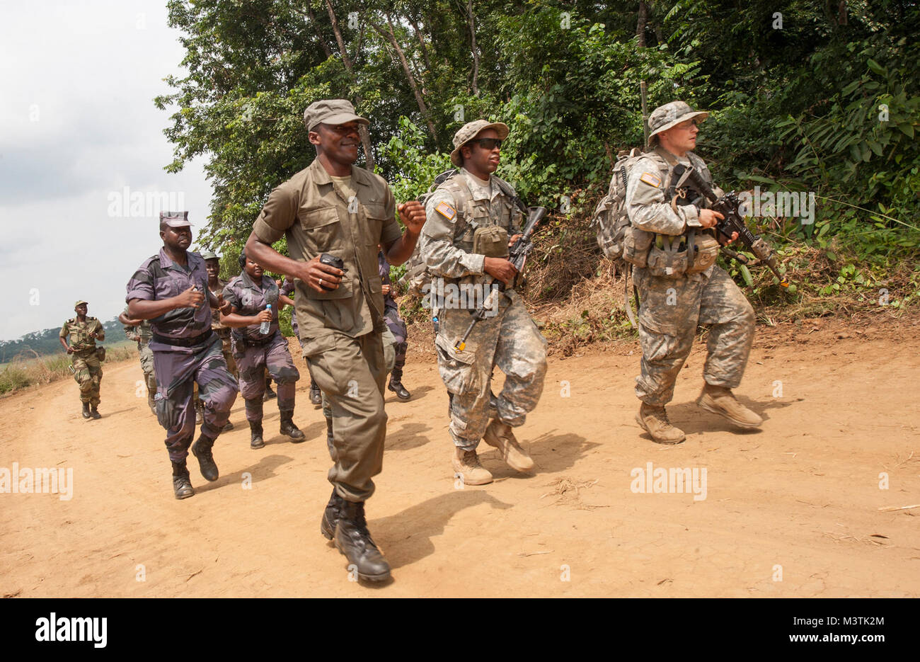 U.S. Army Infantry Soldiers run in formation with their Gabonese ...
