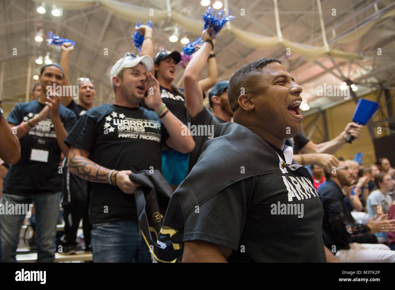 Army fans cheer for their team during archery finals in the 2016 ...