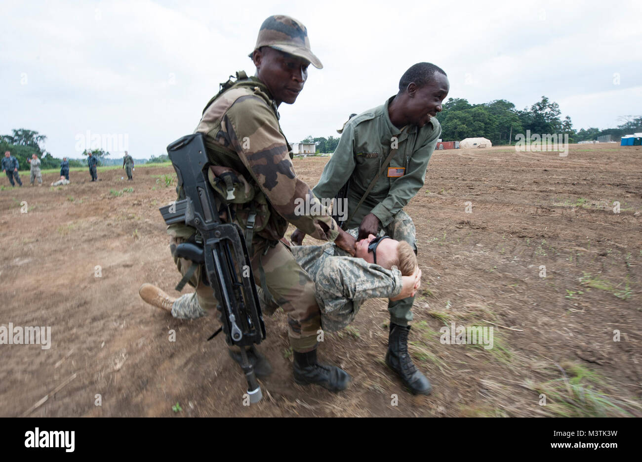 Gabonese Armed Force’s Soldiers carry an U.S. Army Infantryman with the ...
