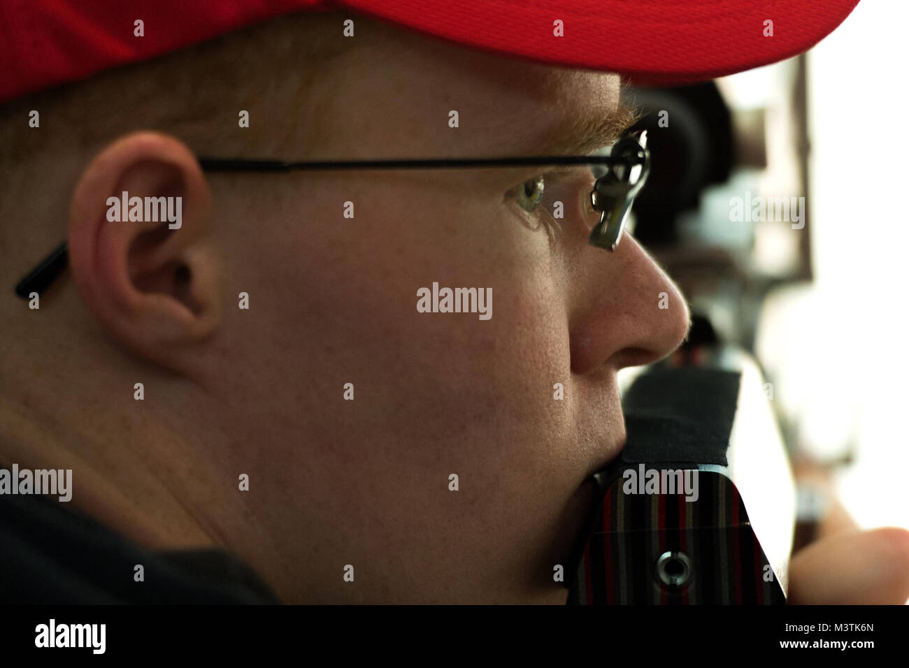 Marine Corps Lance Cpl. Joshua Bacon rests between shots during the ...
