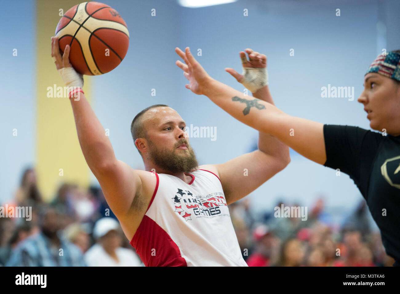 Marine Corps veteran Clayton McDaniel keeps the ball away from Army ...