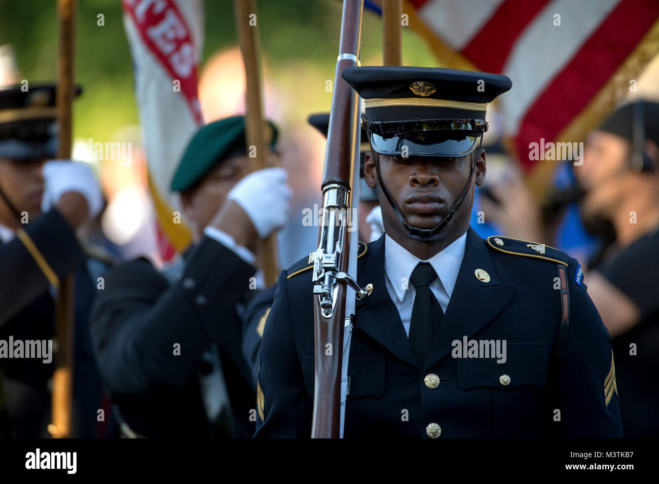 A soldier leads the Color Guard for the 2016 Department of Defense ...