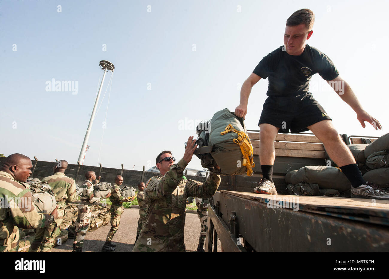 U.S. Army Staff Sgt. Brad Thomas (center), a paratrooper with the 82nd ...