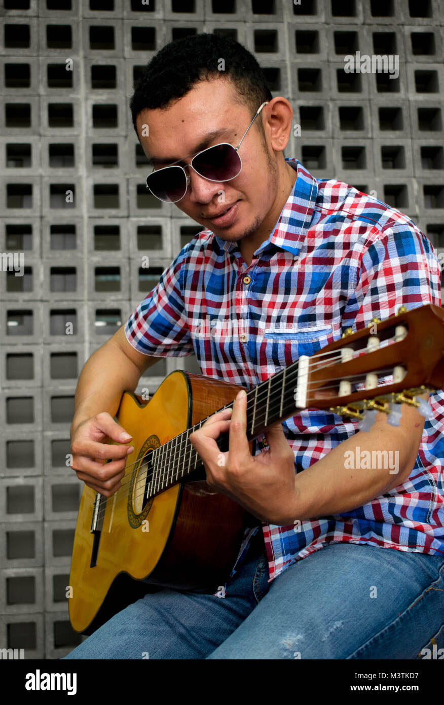 Cool guy playing guitar Stock Photo - Alamy