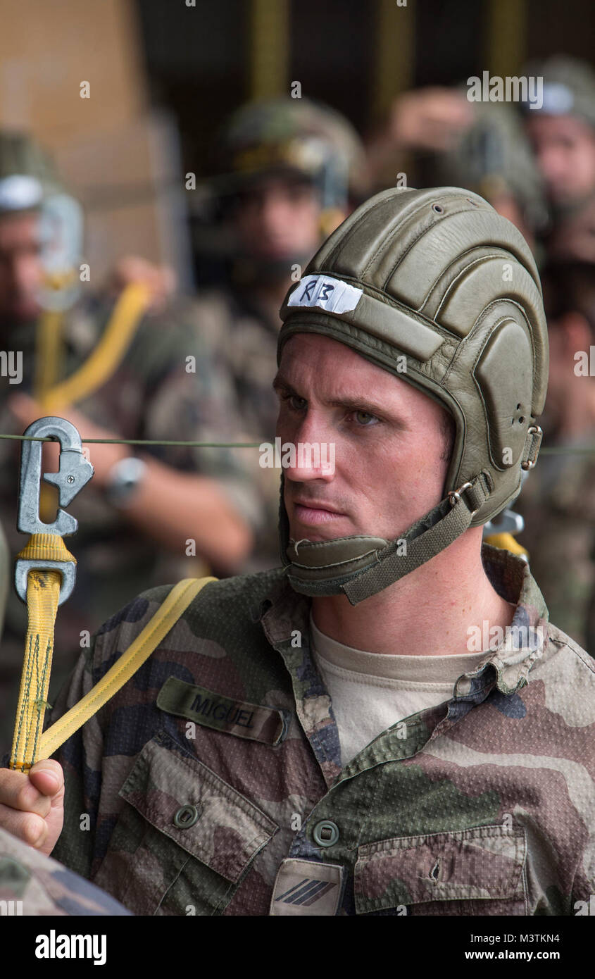 A French paratrooper listens to instructions from a U.S. Army ...