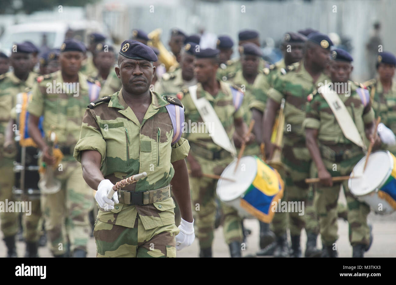 Members of the Gabonese Armed Forces Military Band march across a ...