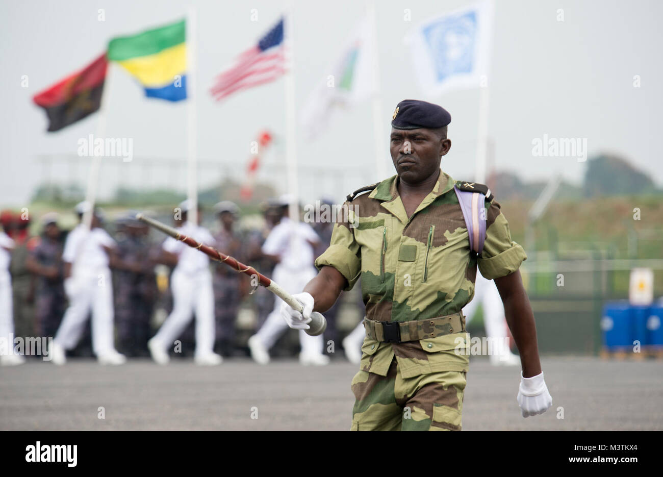 A member of the Gabonese Armed Forces Military Band marches across a ...