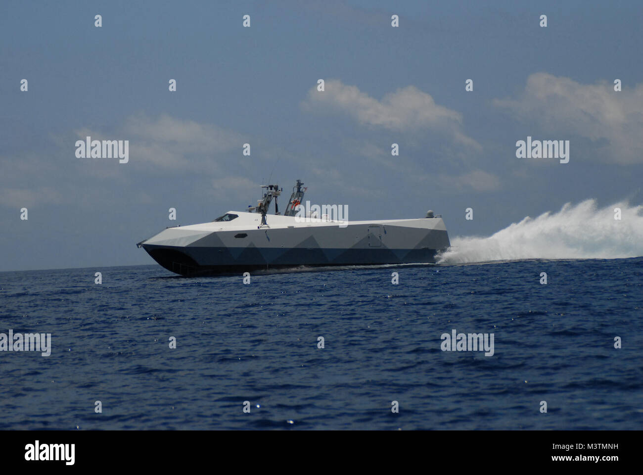 The experimental ship Stiletto cruises at high speed while ...