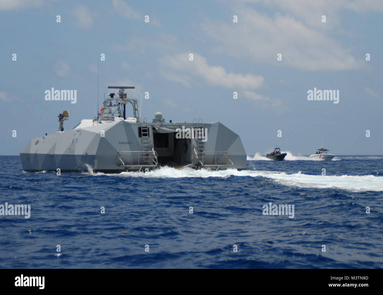 U.S. Coast Guard personnel aboard a Rigid Hull Inflatable Boat (RHIB ...