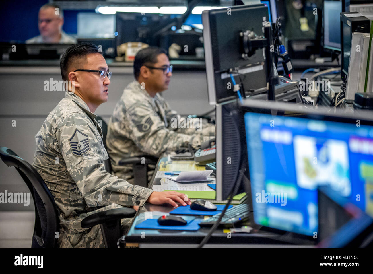 Master Sgt. Michael Cho, left, and Staff Sgt. Bronson Tactay, air ...