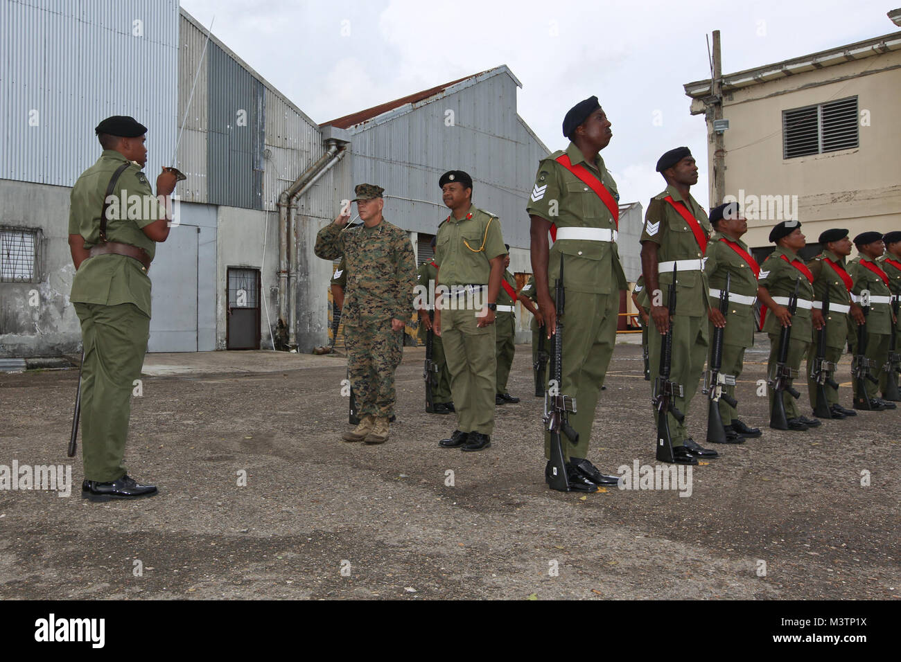 Commandant of the Marine Corps Gen. Robert B. Neller, salutes a member ...
